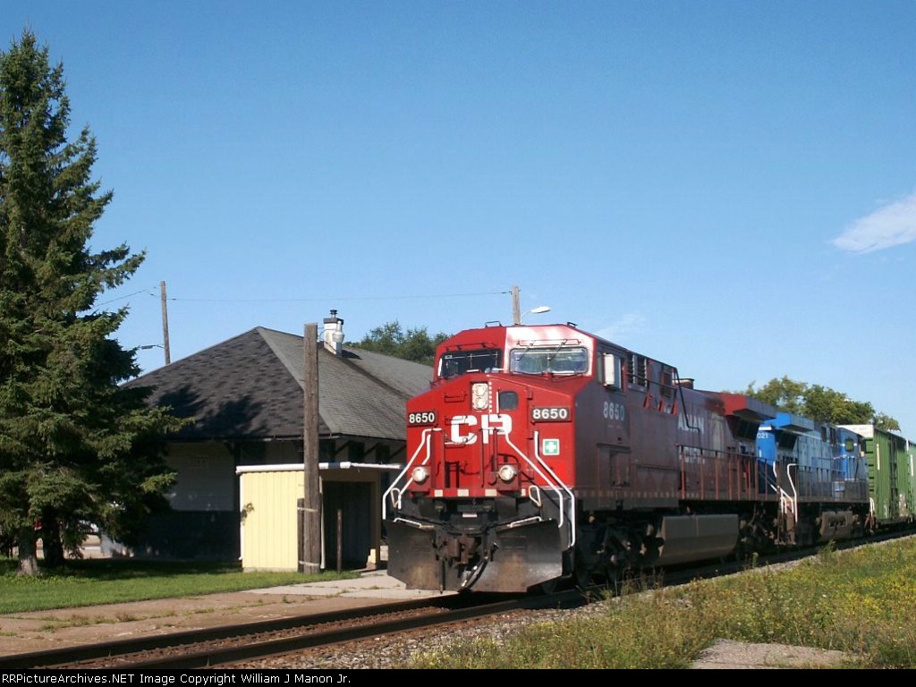 CP 8650 hurries past the Depot